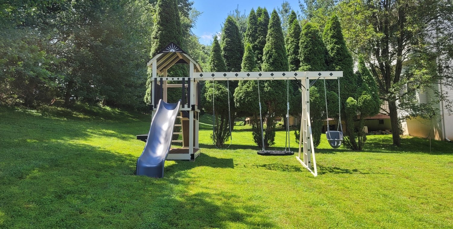 Custom Swing Sets and Yards with Slopes